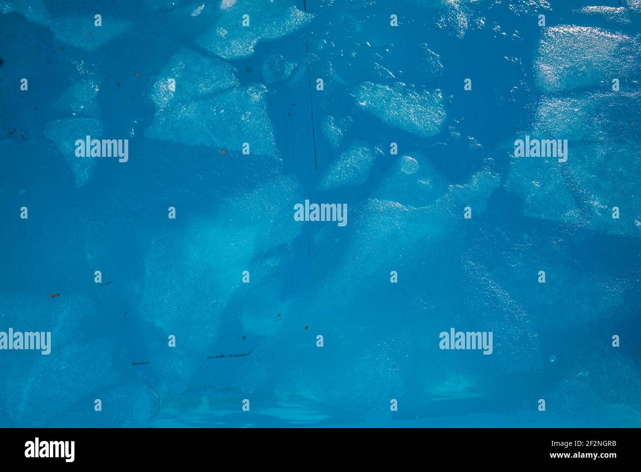Ice texture on the pool in the winter Stock Photo - Alamy
