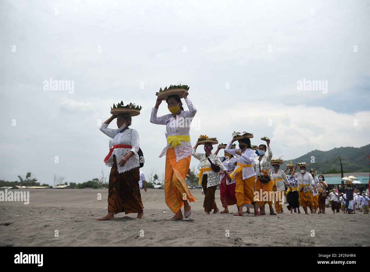 People in Yogyakarta carry out the Melasti ceremony, adhering to ...