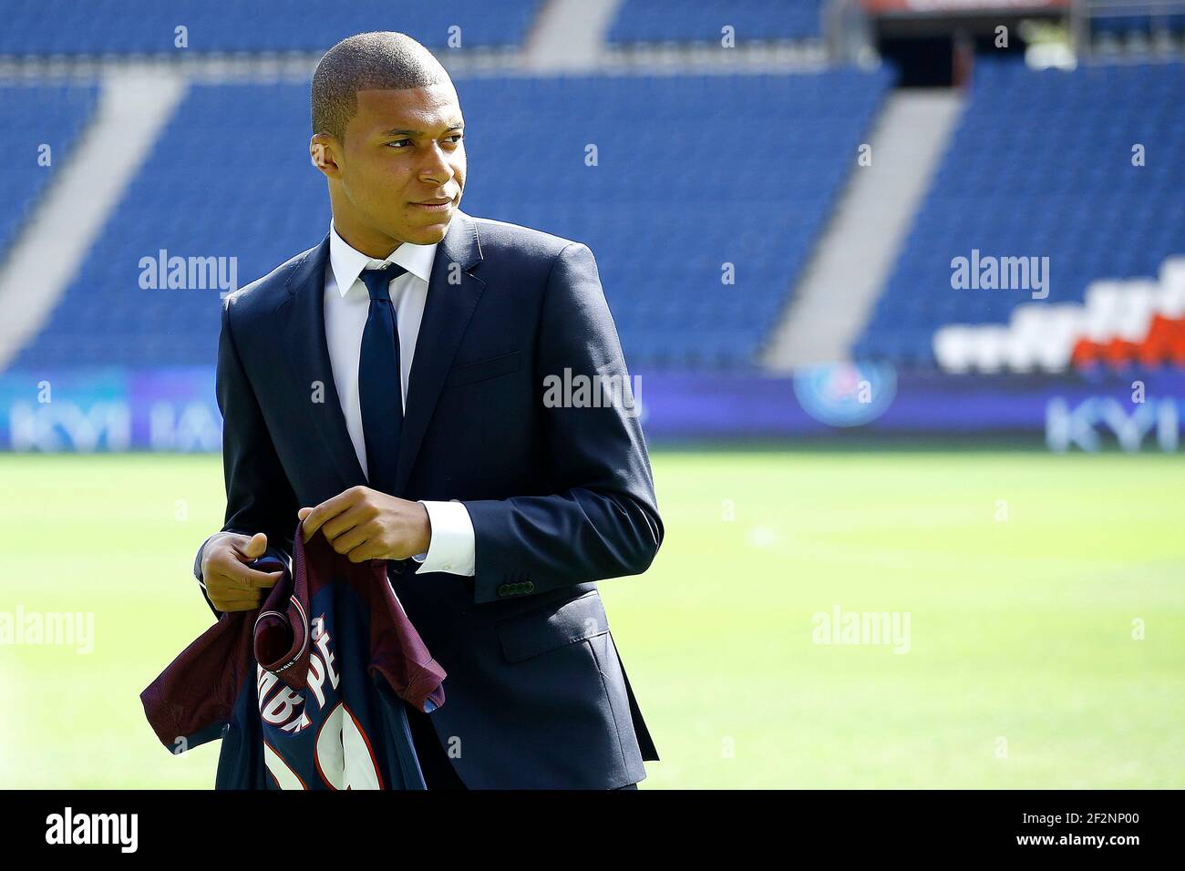 Paris Saint-Germain's new player Kylian Mbappe holds his jersey during ...