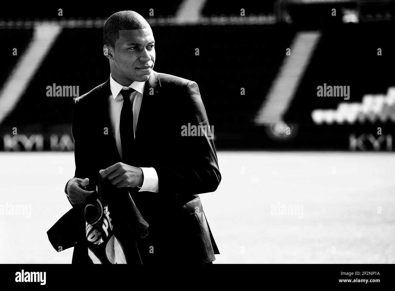 Paris Saint-Germain's new player Kylian Mbappe holds his jersey during ...