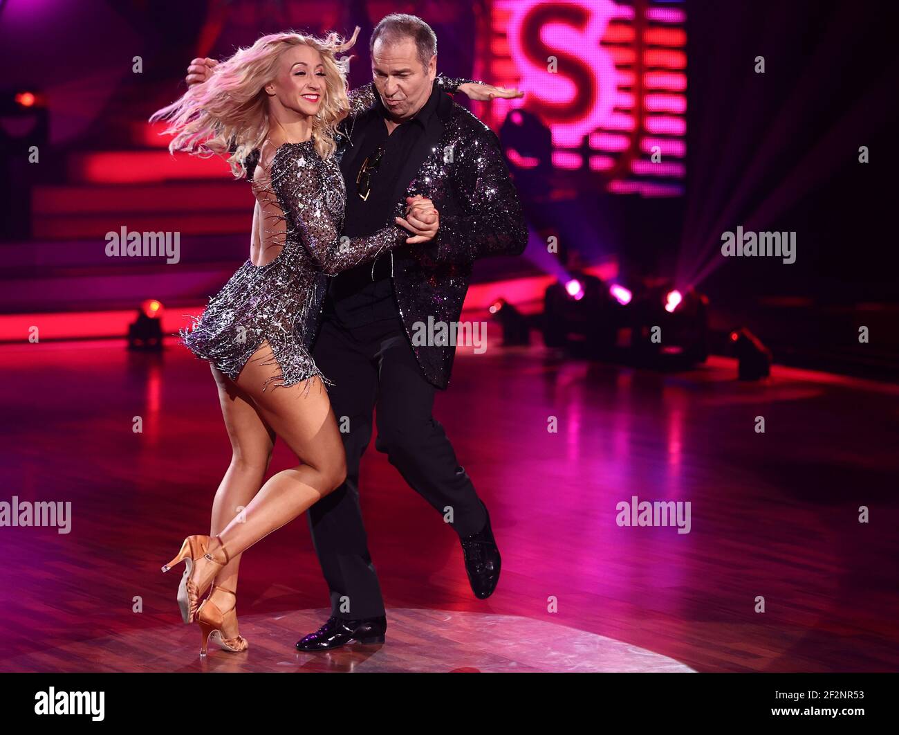 Cologne, Germany. 12th Mar, 2021. Kai Ebel, presenter, and Kathrin ...