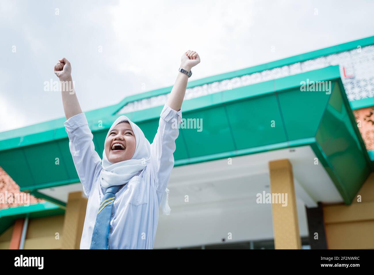High school girl raising hand teen hi-res stock photography and images ...