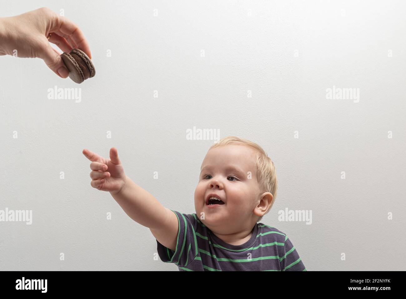 Kid reaching for cookie hi-res stock photography and images - Alamy