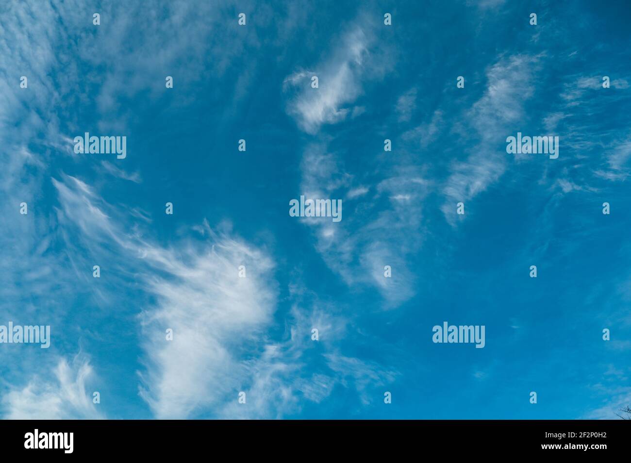 Blue sky with few clouds Stock Photo - Alamy