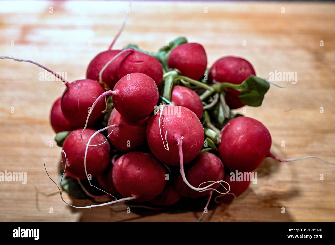 A bunch of radishes on the kitchen shelf Stock Photo - Alamy