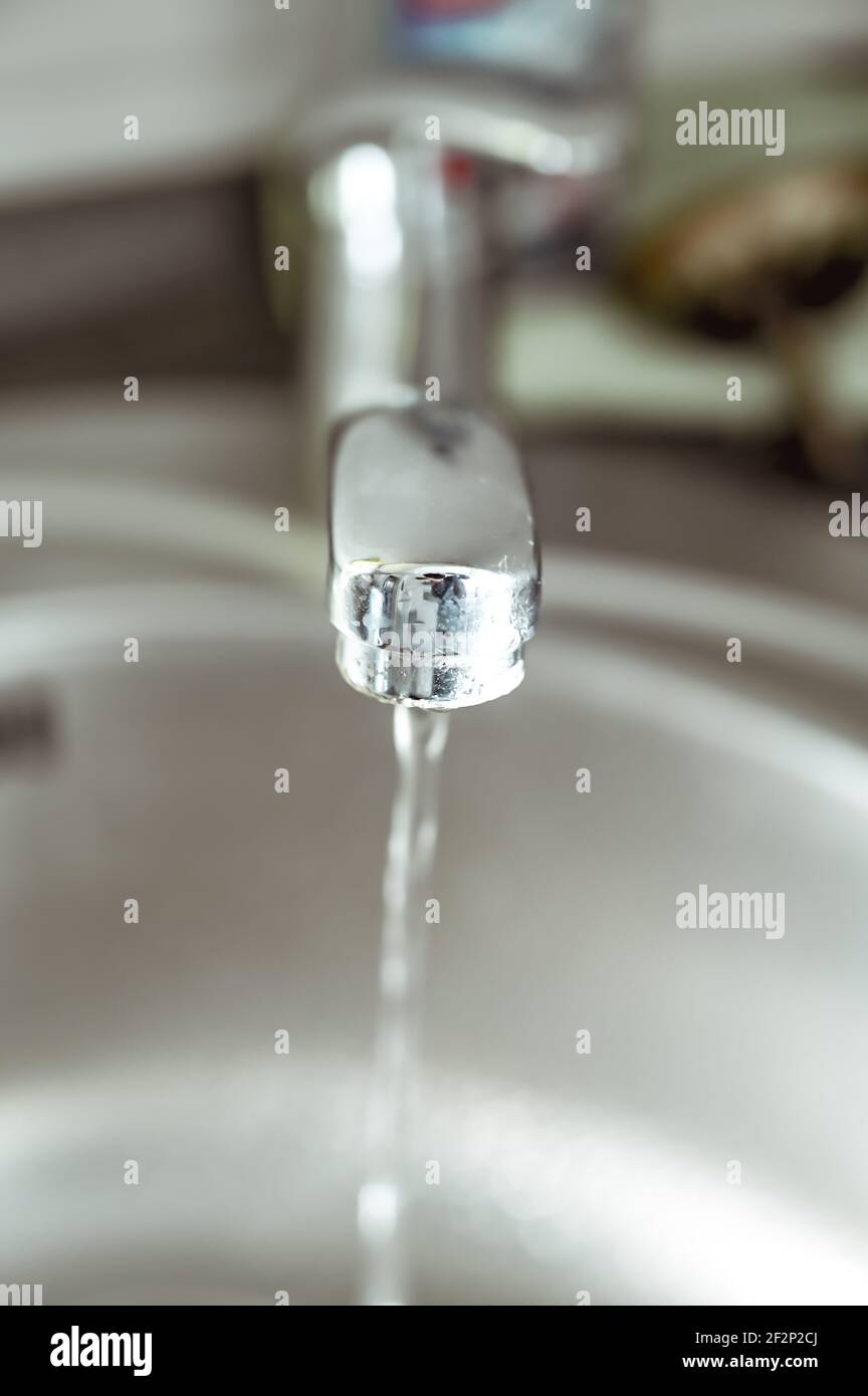 Water running from a tap Stock Photo - Alamy