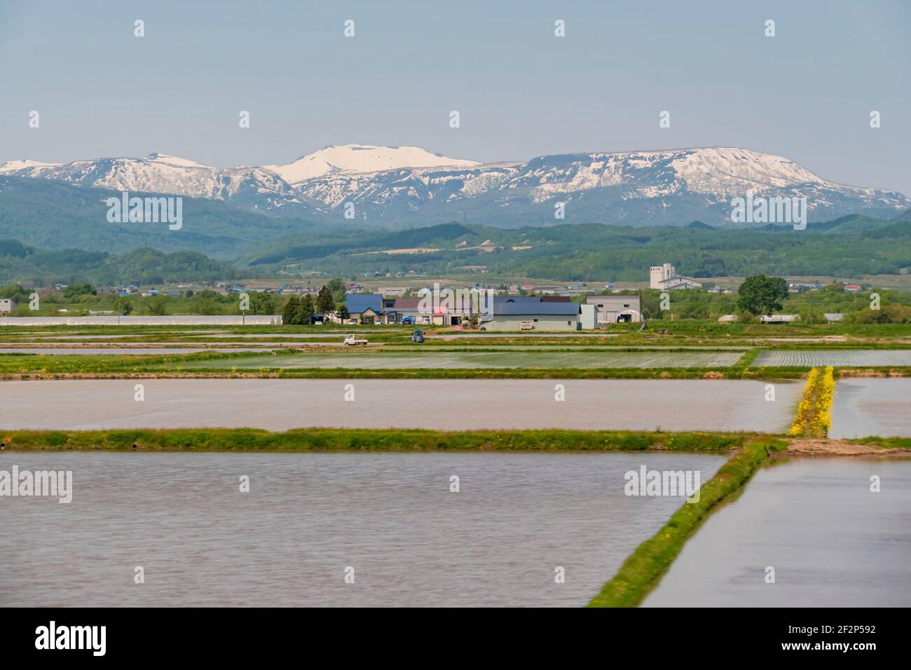 Rural farm landscape with snowy mountain at Hokkaido, Japan Stock Photo ...
