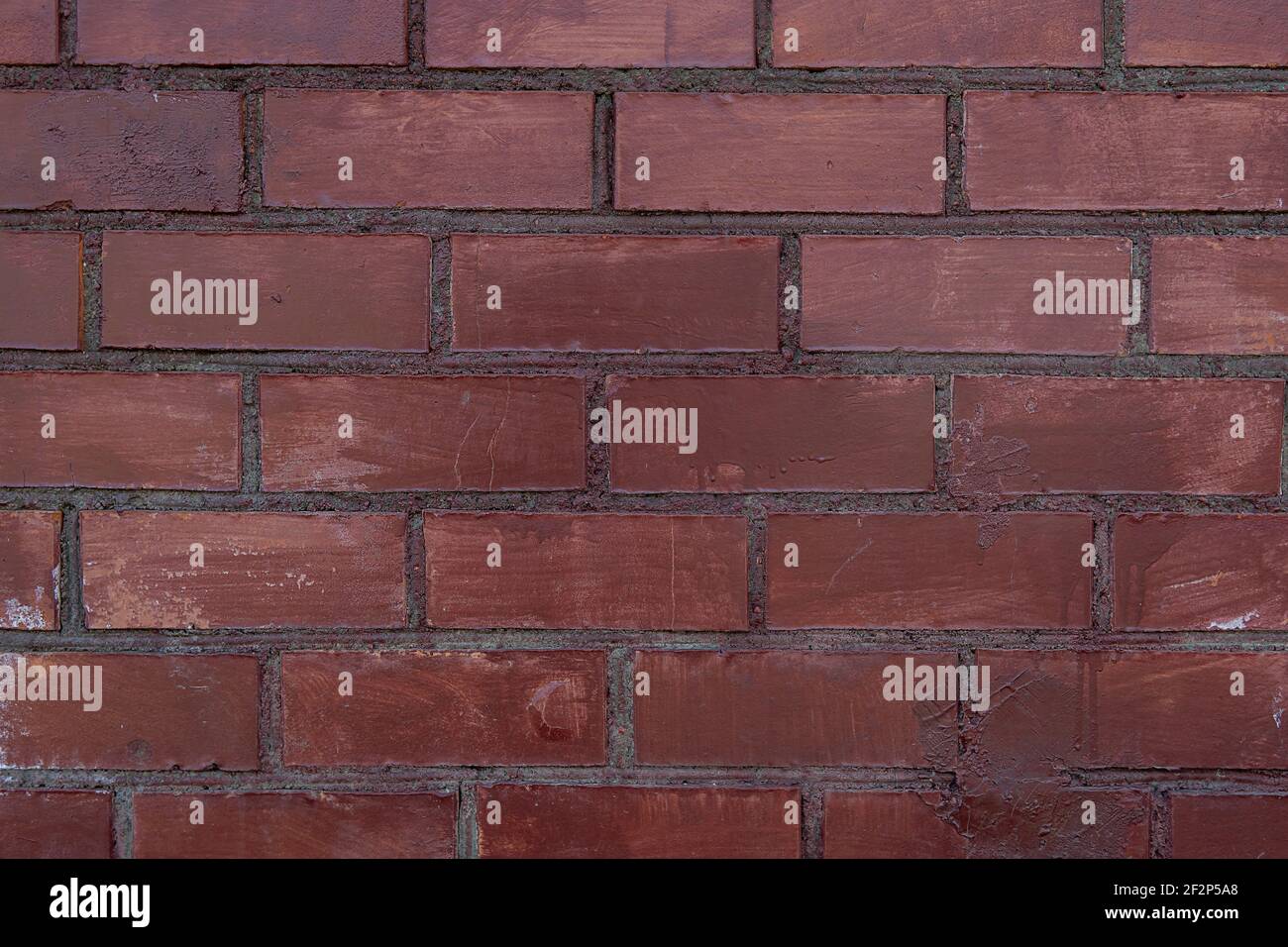 Red brick wall with dim light for background Stock Photo - Alamy