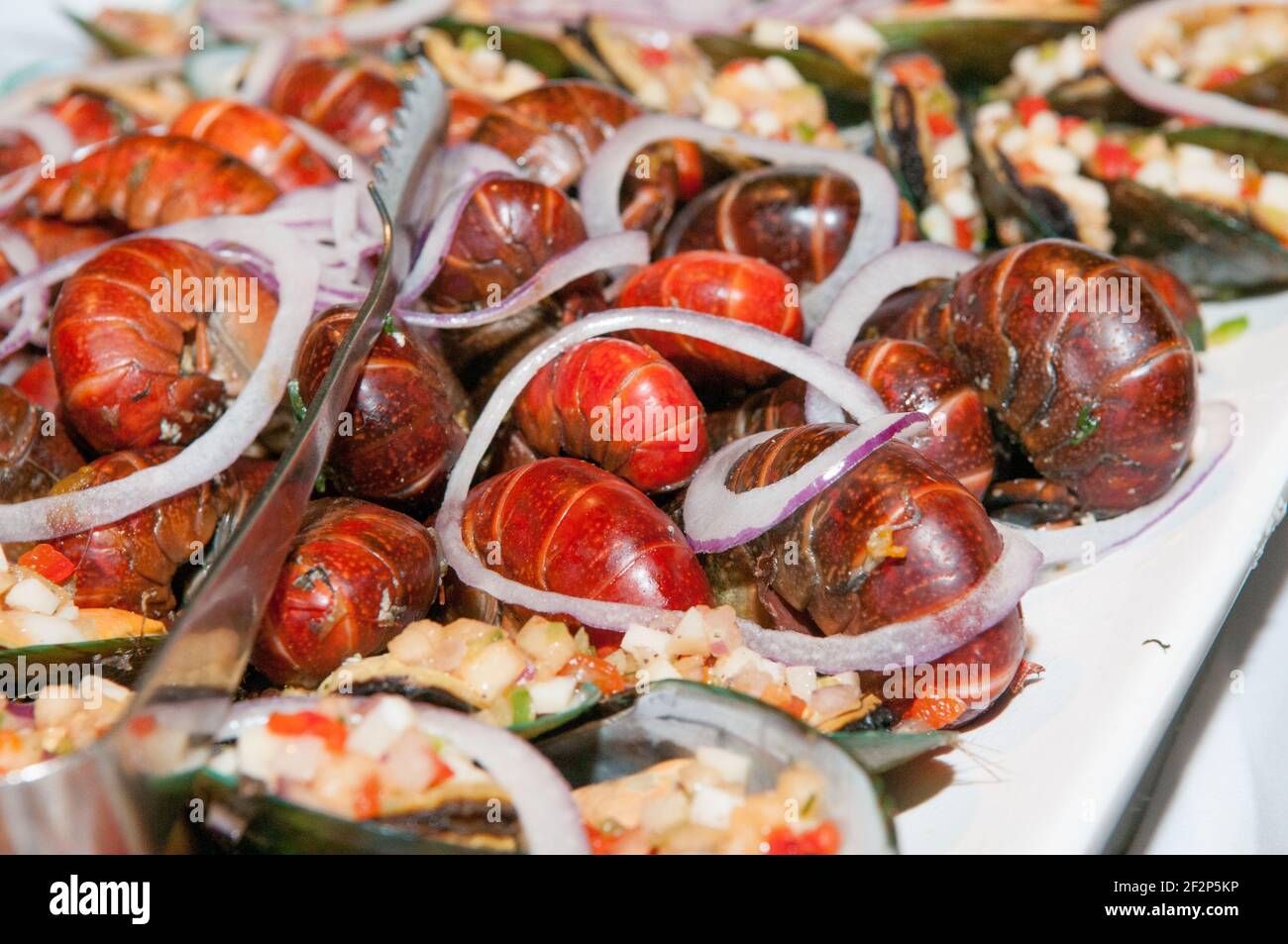 Delicious seafood - boiled crawfish with raw red onion on the top Stock ...