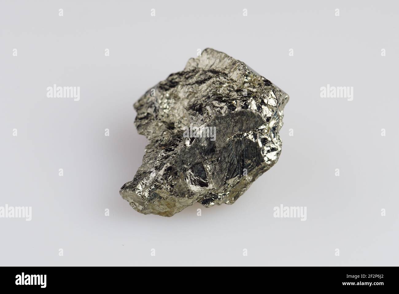 Natural pyrite on white background Stock Photo - Alamy