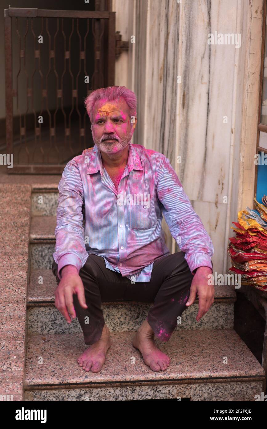 India Vrindavan Portrait of man covered in colored powder during the ...