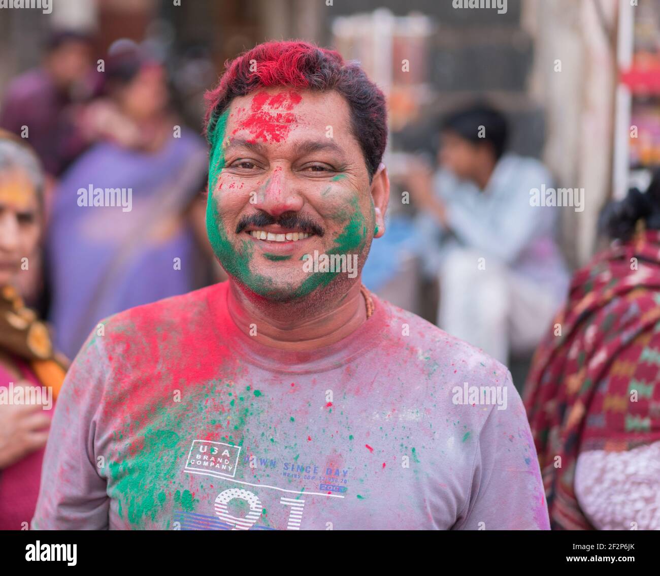 India Vrindavan Portrait of man covered in colored powder during the ...