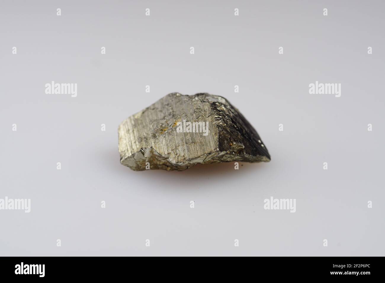 Natural pyrite on white background Stock Photo - Alamy