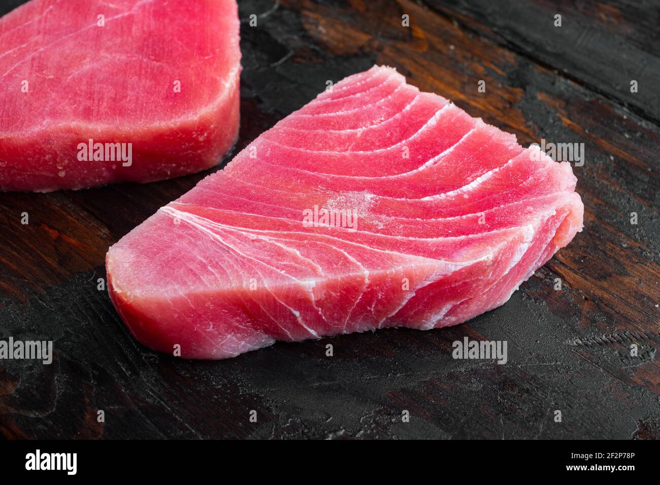 Raw tuna steak, fresh red tuna fish fillet set, and old butcher cleaver ...