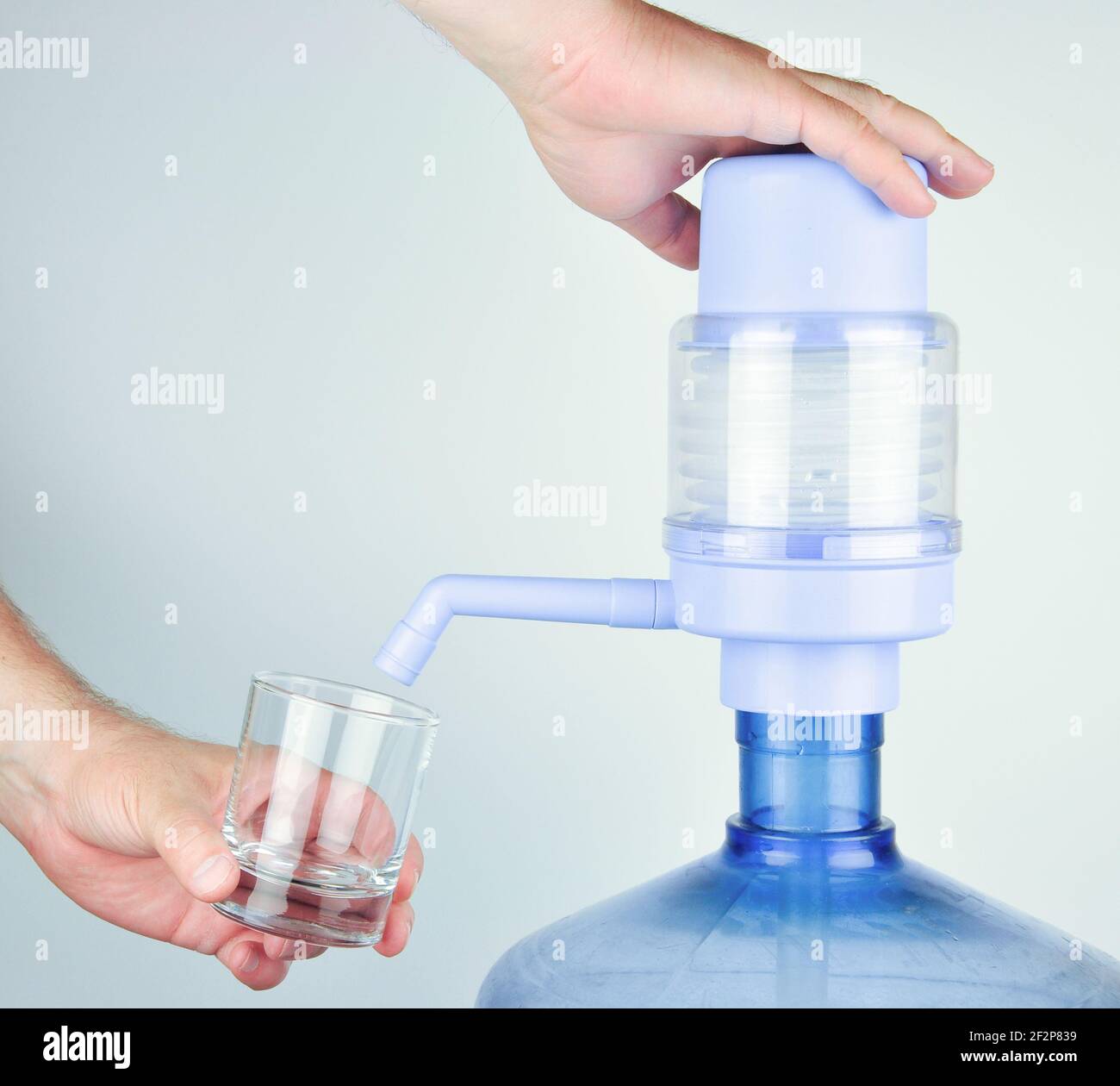 Hand water pump. Water pump for home and office use, isolated on white ...