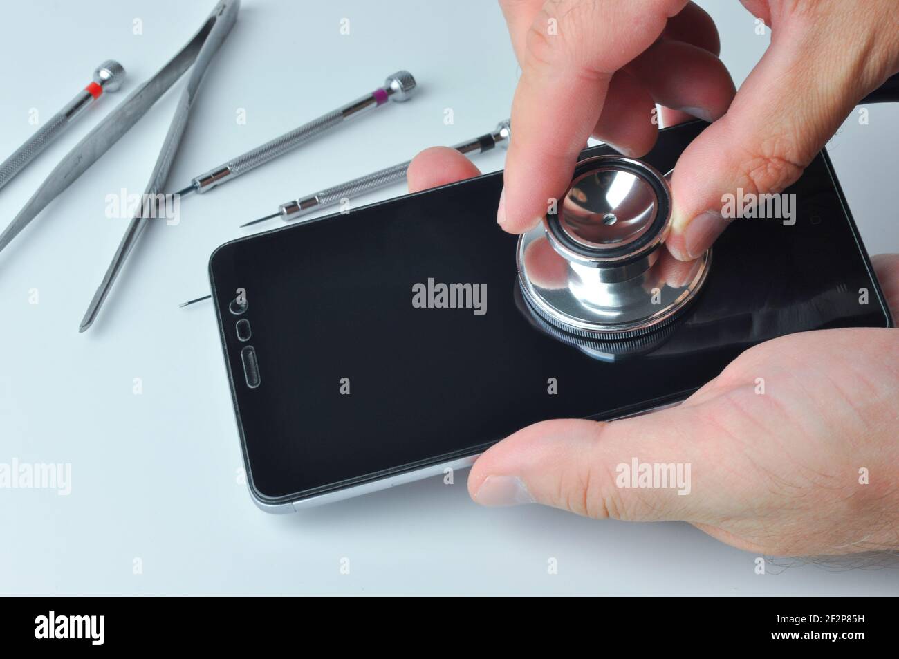 Men using a stethoscope for phone examination with empty copy space ...