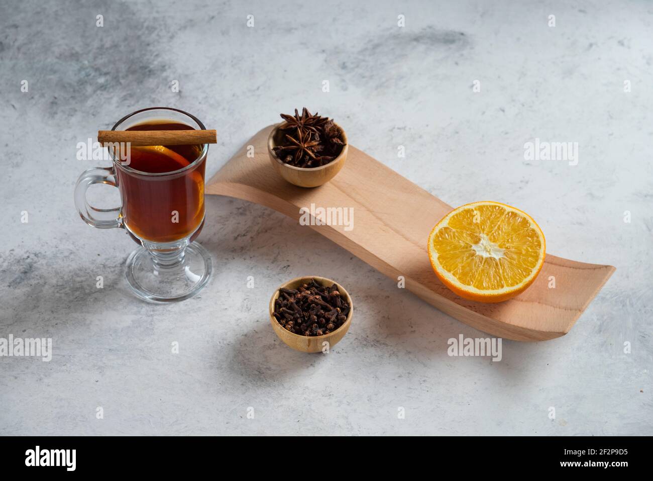 A cup of tea with slice of orange and dried loose teas Stock Photo - Alamy