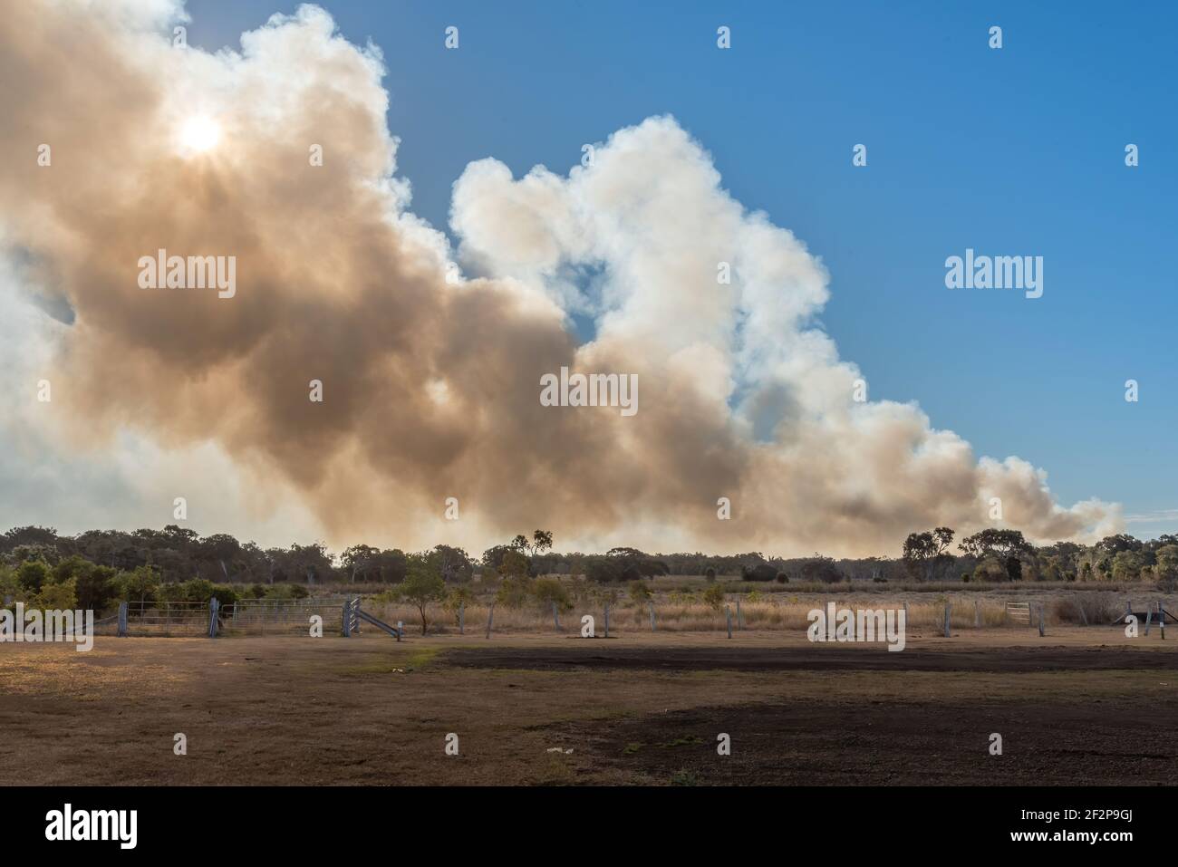 The smoke from a near by fire spreads across the sky Stock Photo - Alamy