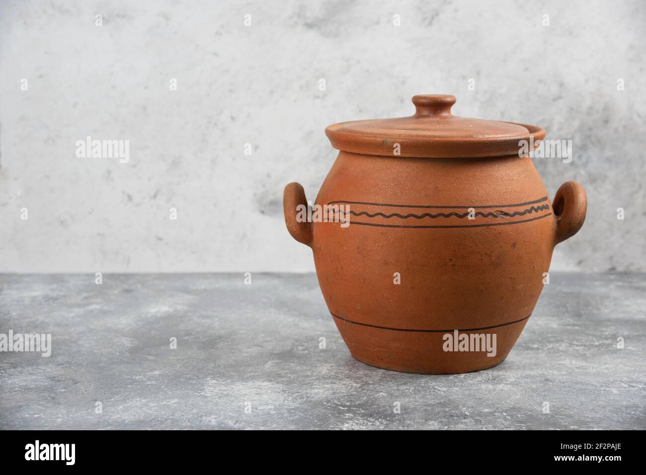 Single clay antique vase placed on marble surface Stock Photo - Alamy