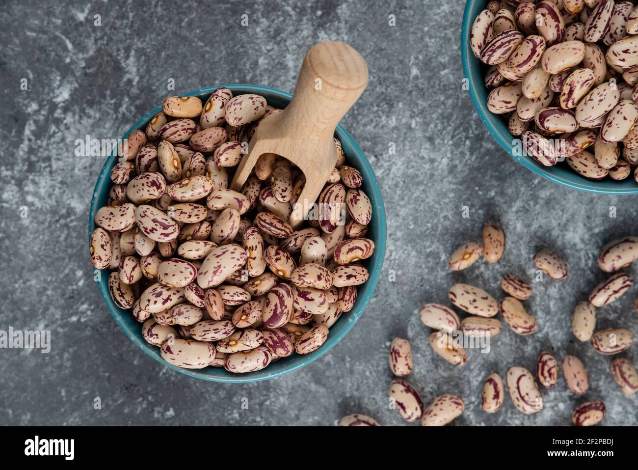 Raw bean grains displayed in blue bowls Stock Photo - Alamy