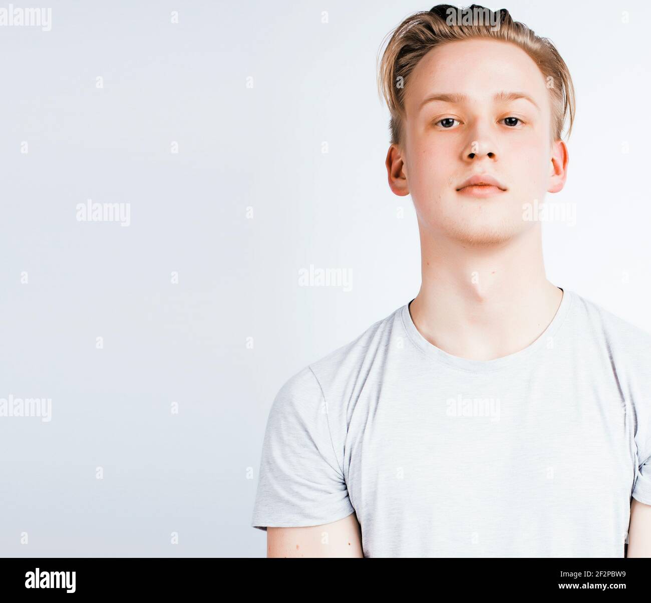 young handsome teenage hipster guy posing emotional, happy smiling ...