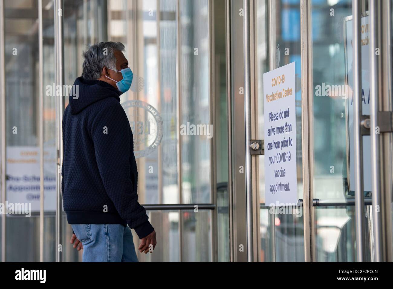 Manhattan, New York, USA. 12th Mar, 2021. A man wearing a PPE mask ...