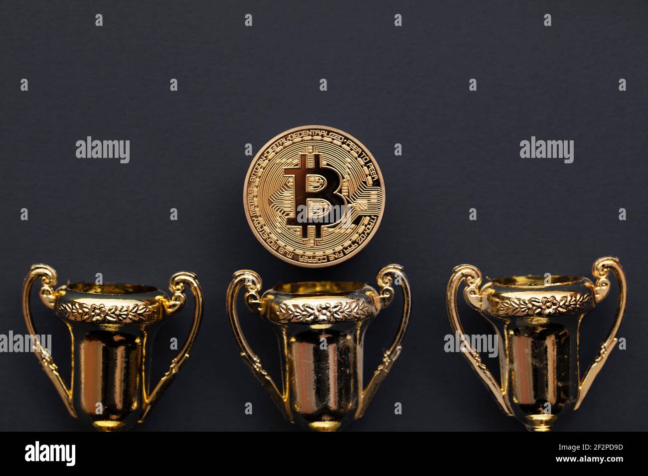 Gold bitcoin cryptocurrency coin with a winning golden trophy Stock ...