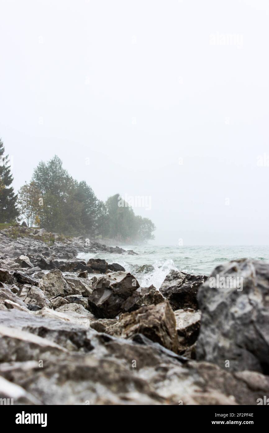Lake, shore, stones Stock Photo - Alamy