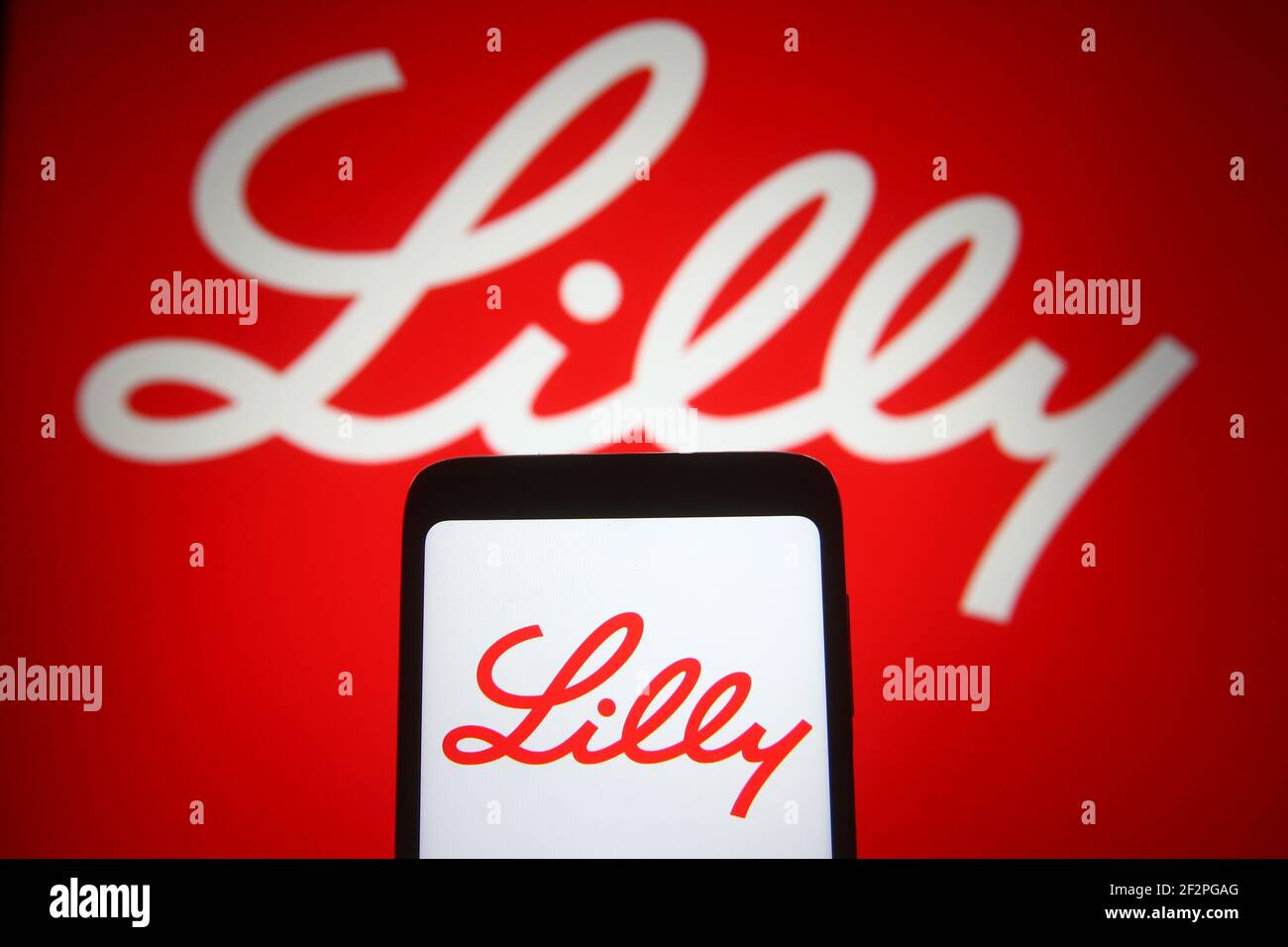 In this photo illustration the Lilly and Company logo of an US ...