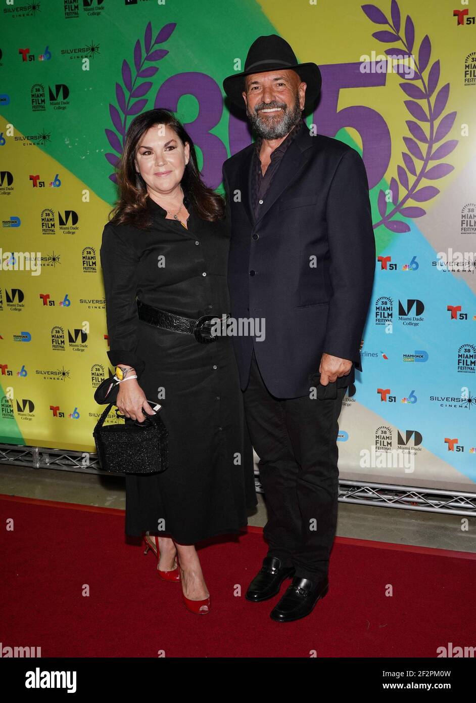 MIAMI, FL - MARCH 12: Actor Gilberto Reyes (R) and wife attend the ...
