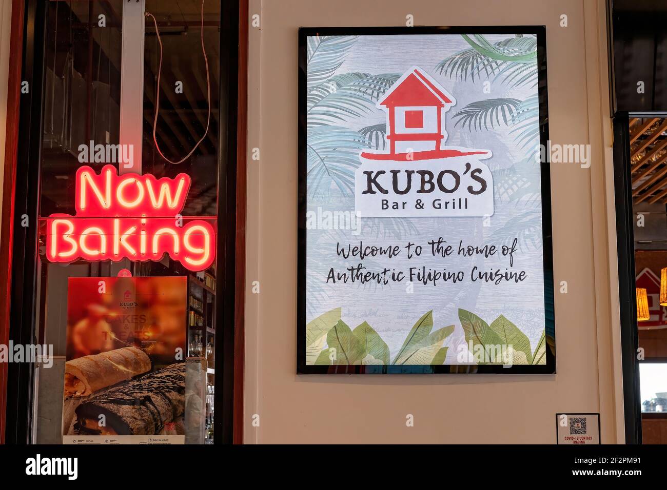 Brisbane, Queensland, Australia - March 2021: Now Baking neon sign at ...