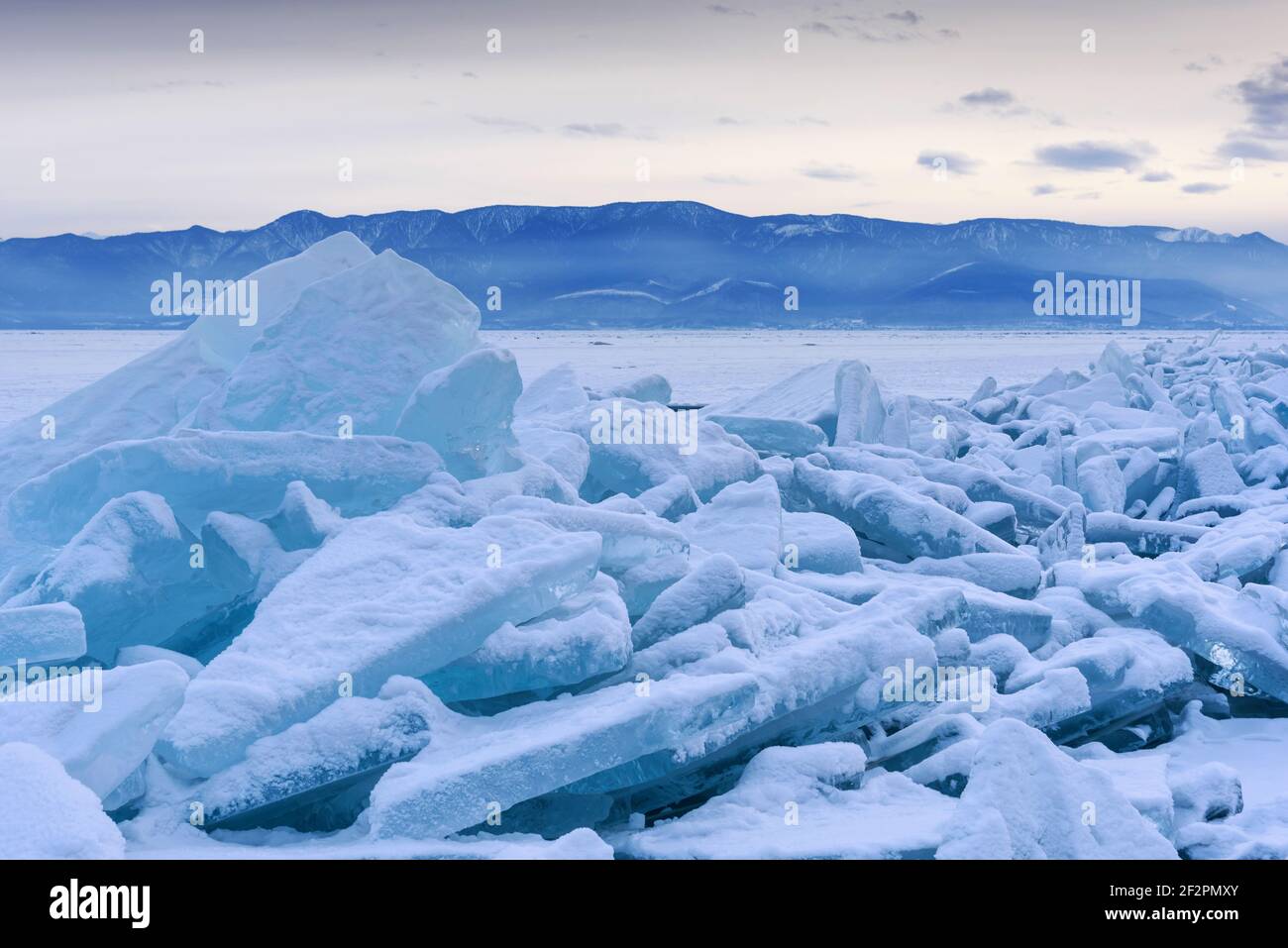 Endless hummock field on the frozen Lake Baikal. Piles of snow-covered ...