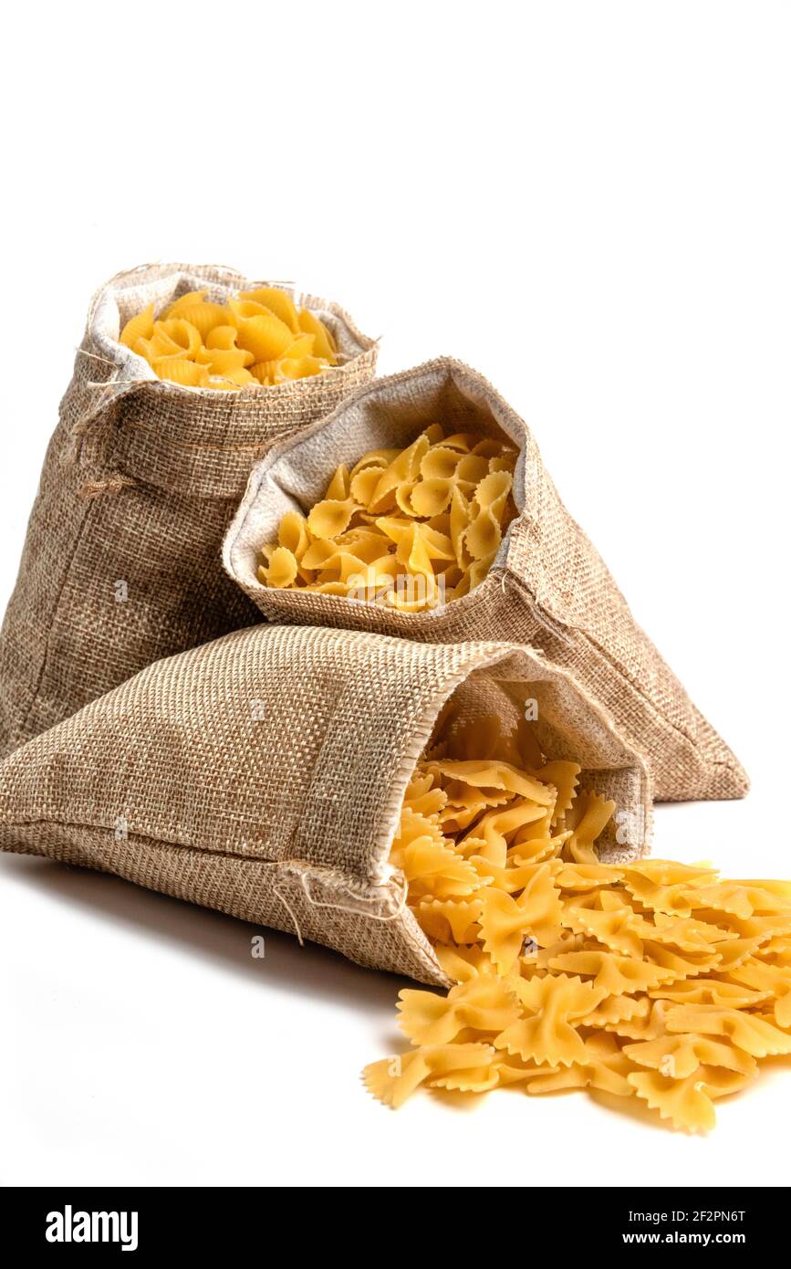 Conchiglie rigate pasta or seashell macaroni in sack isolated Stock ...