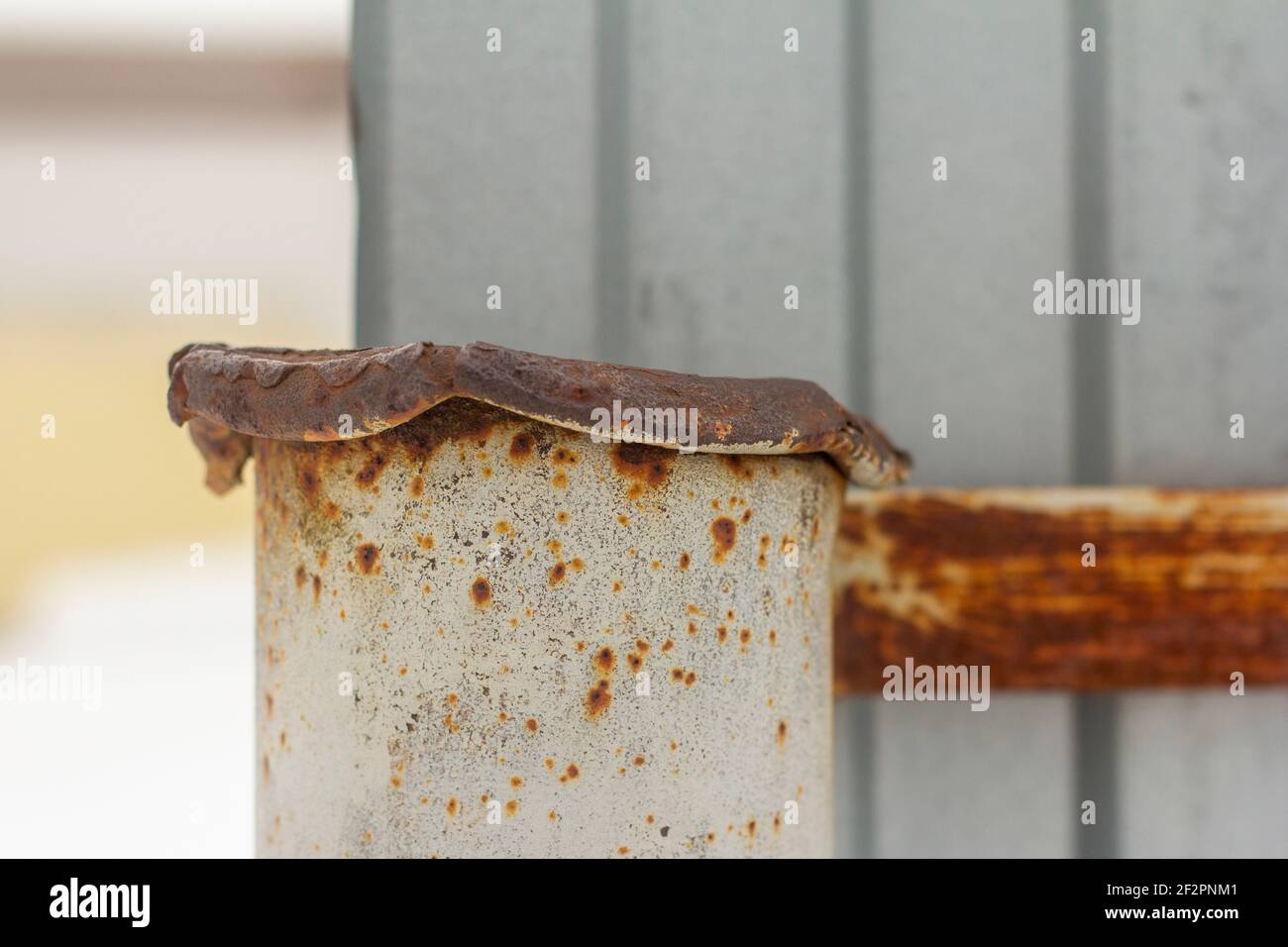 A rusty iron post, the support of a metal fence Stock Photo - Alamy