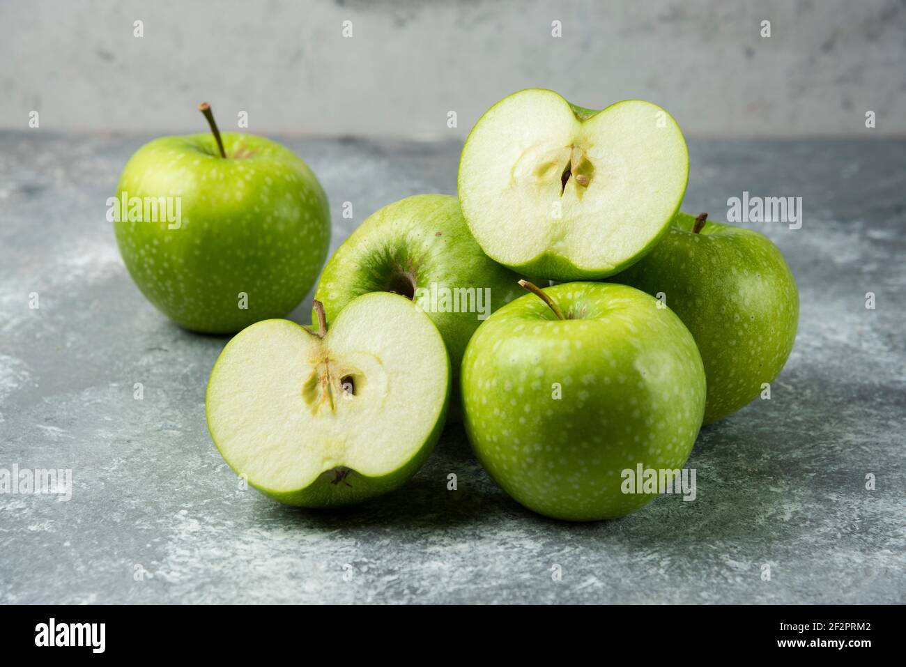 Bunch of green apples on marble background Stock Photo - Alamy
