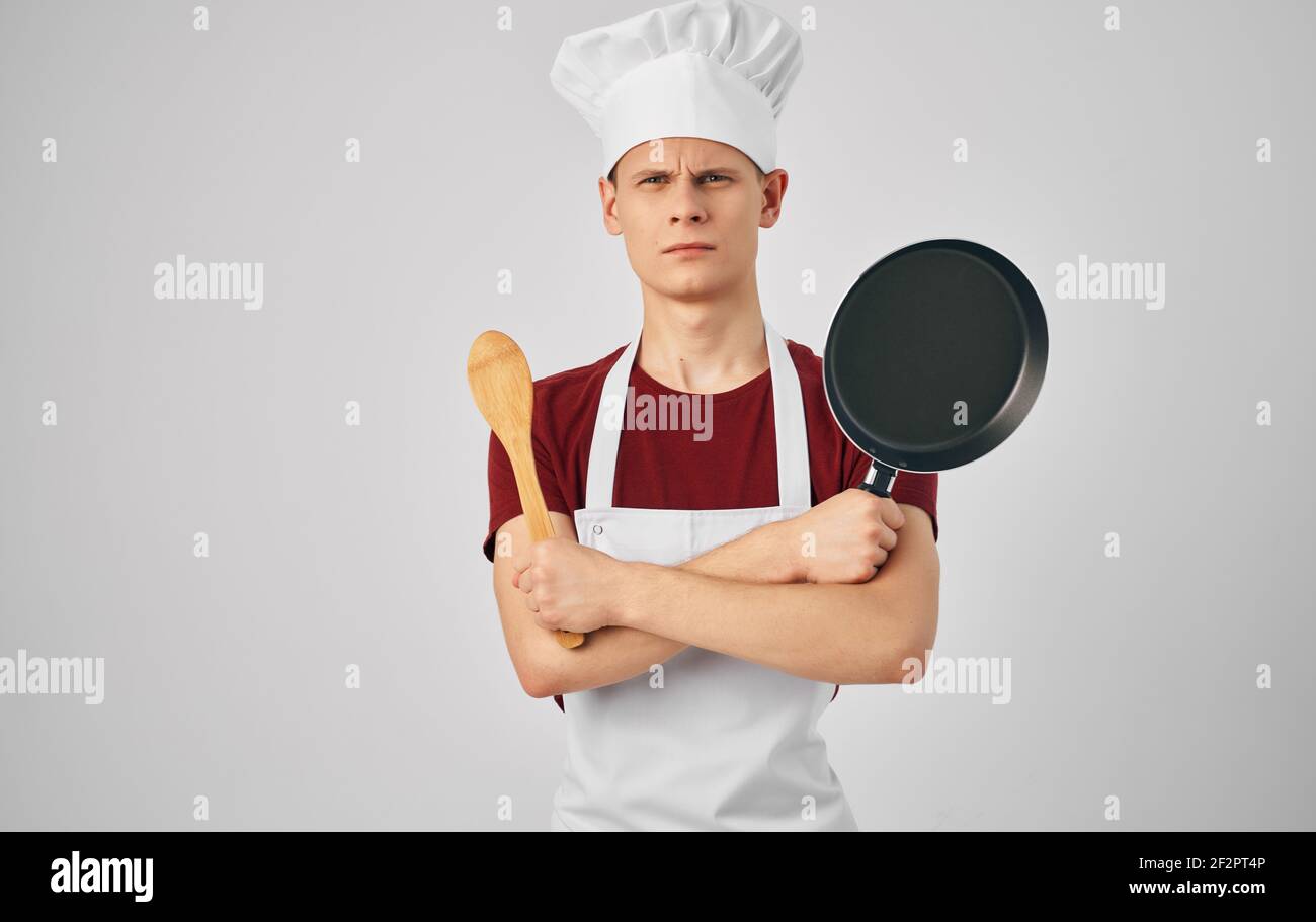 male chef with kitchen utensils cooking food service Stock Photo - Alamy