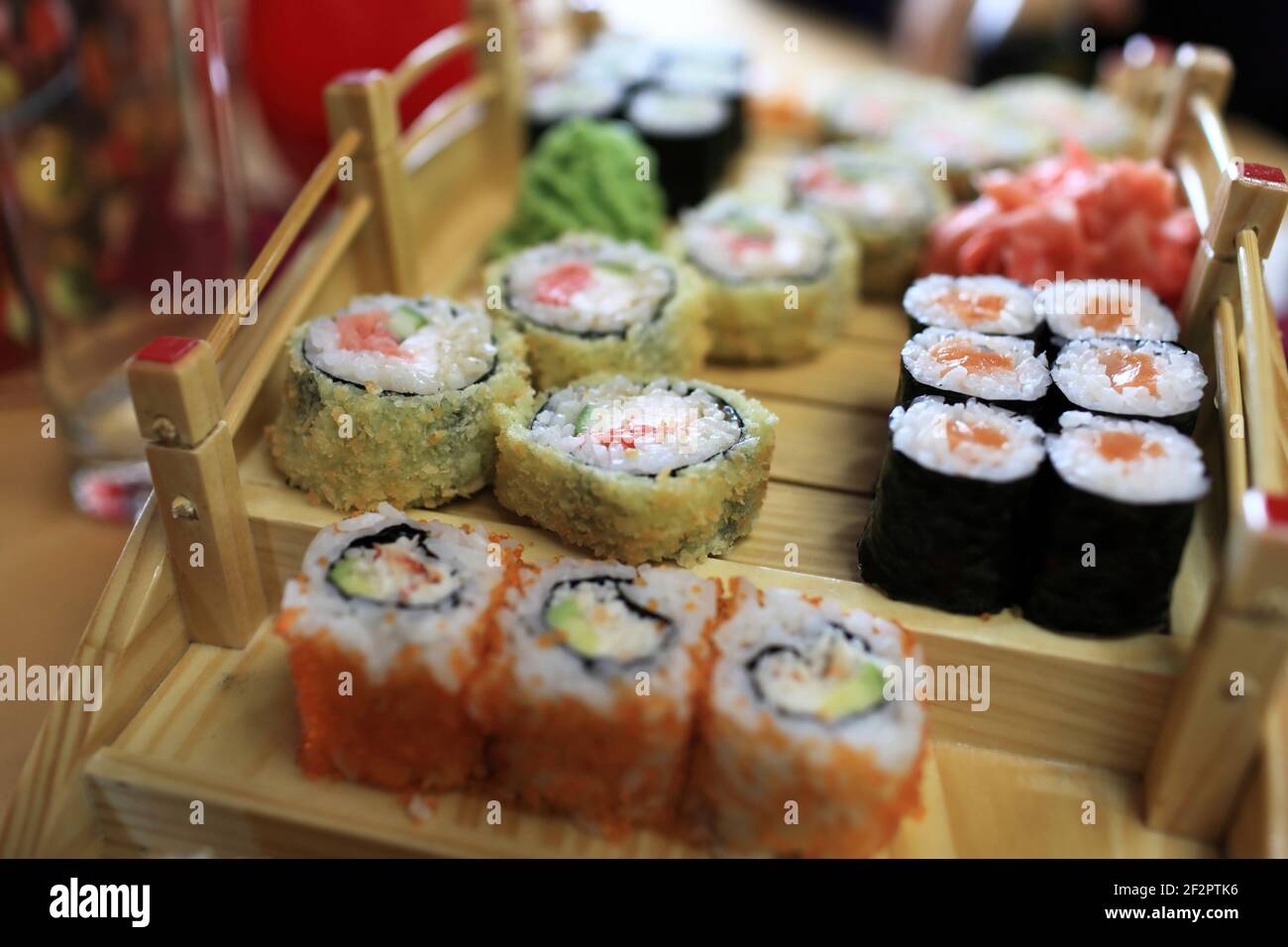 Sushi set on a wooden bridge in the restaurant Stock Photo - Alamy