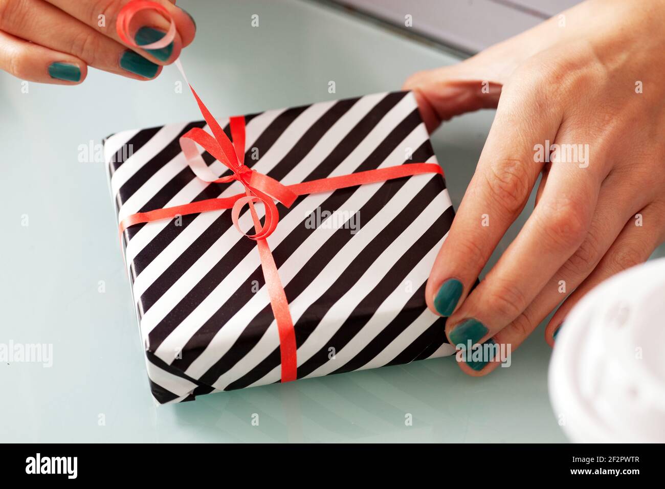 Unwrapping present hi-res stock photography and images - Alamy