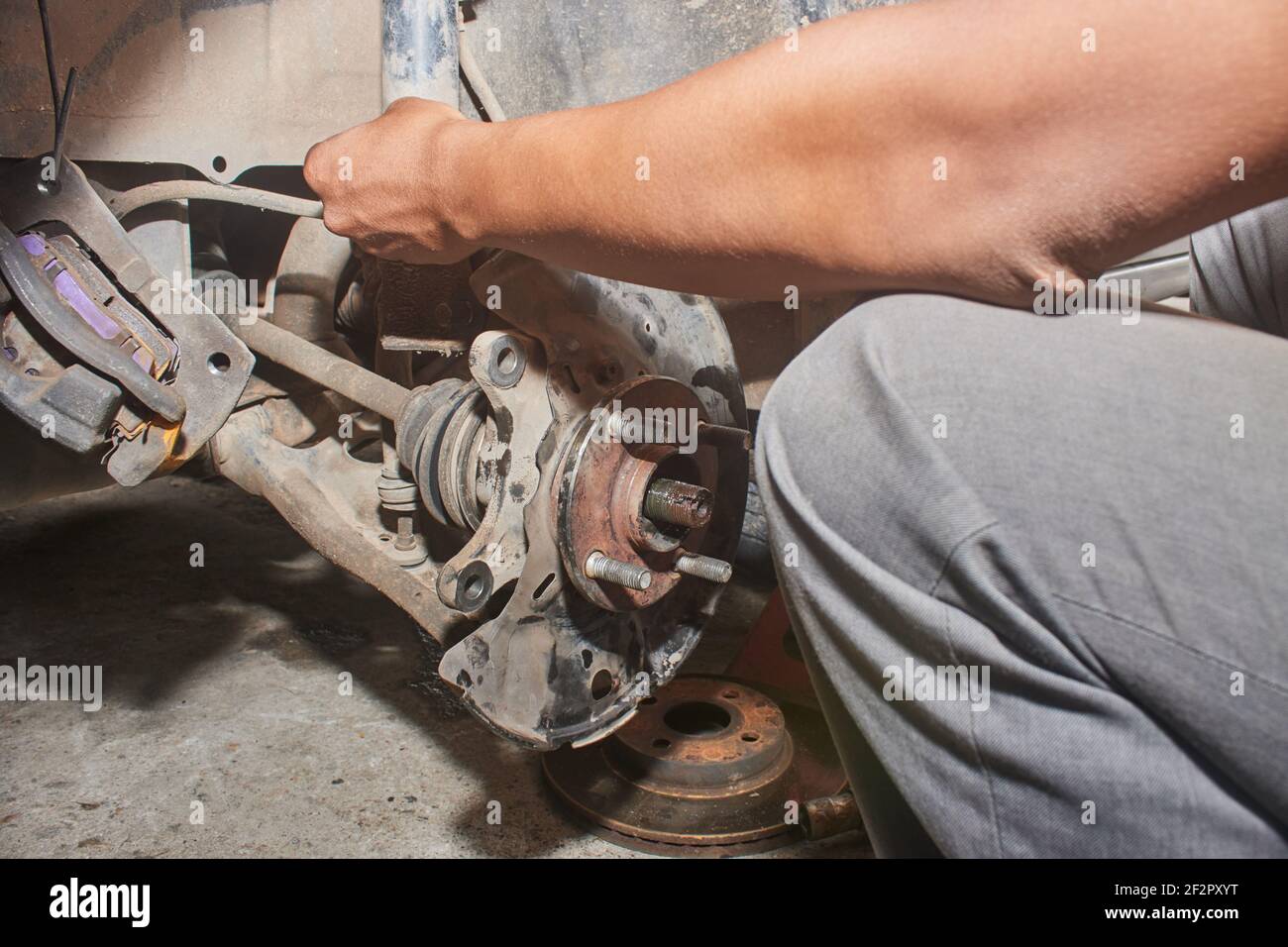 Car Mechanic Check and Remove and Maintenance Car Wheel Hub and Drive ...