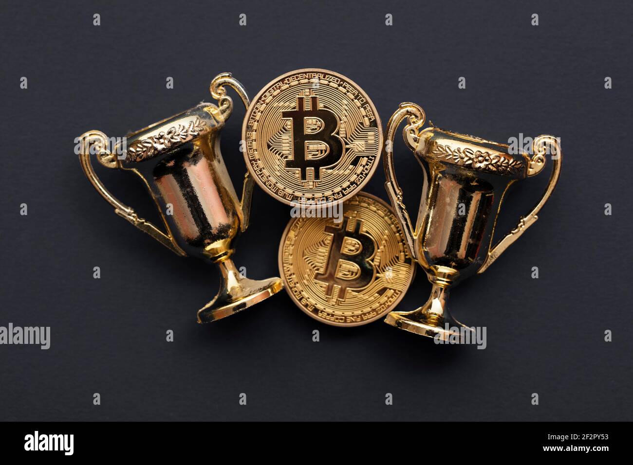 Gold bitcoin cryptocurrency coin with a winning golden trophy Stock ...