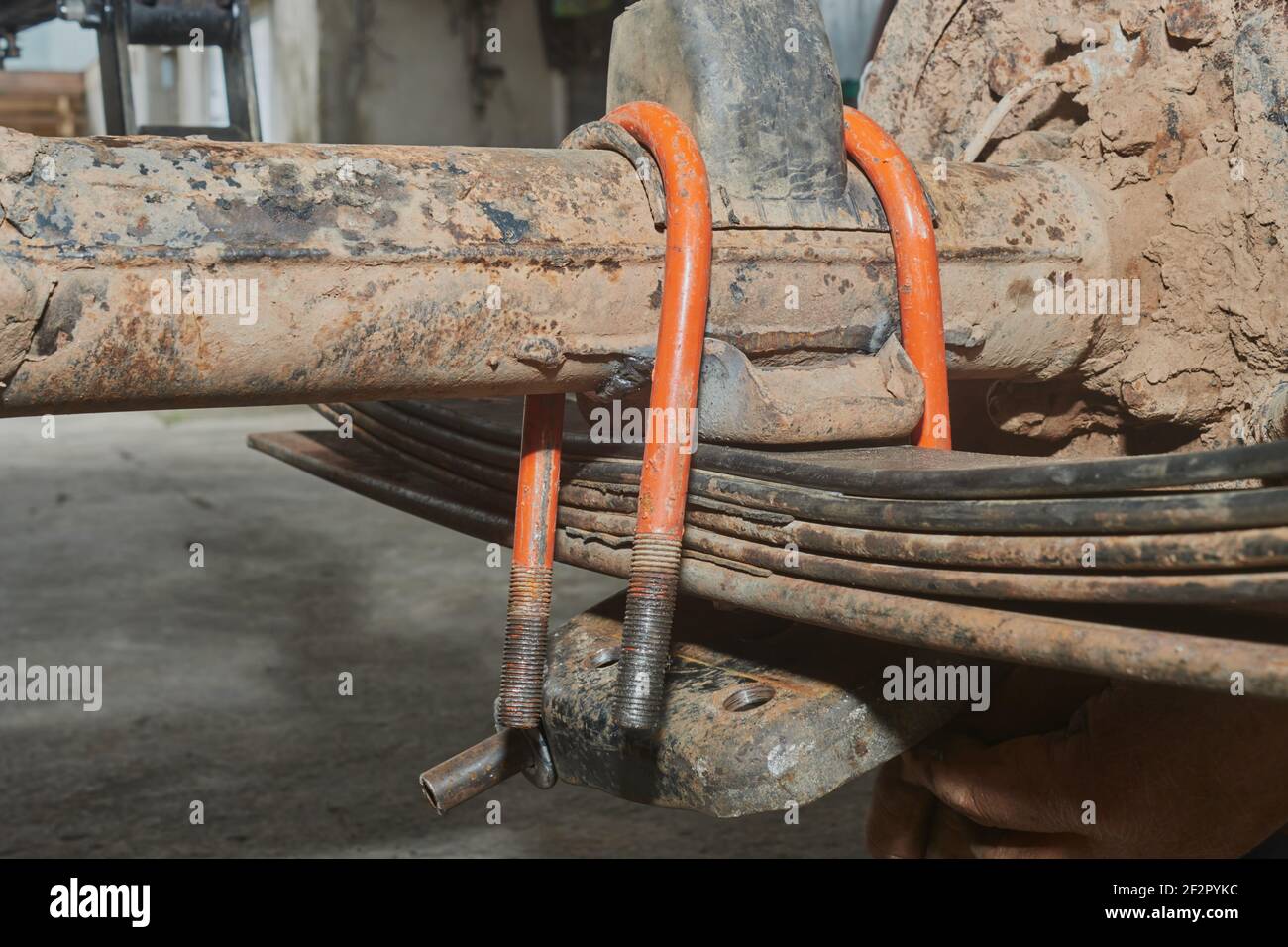 Front View Orange U-Bolt with Bump Stop on Rear Axle and Leaf Spring ...