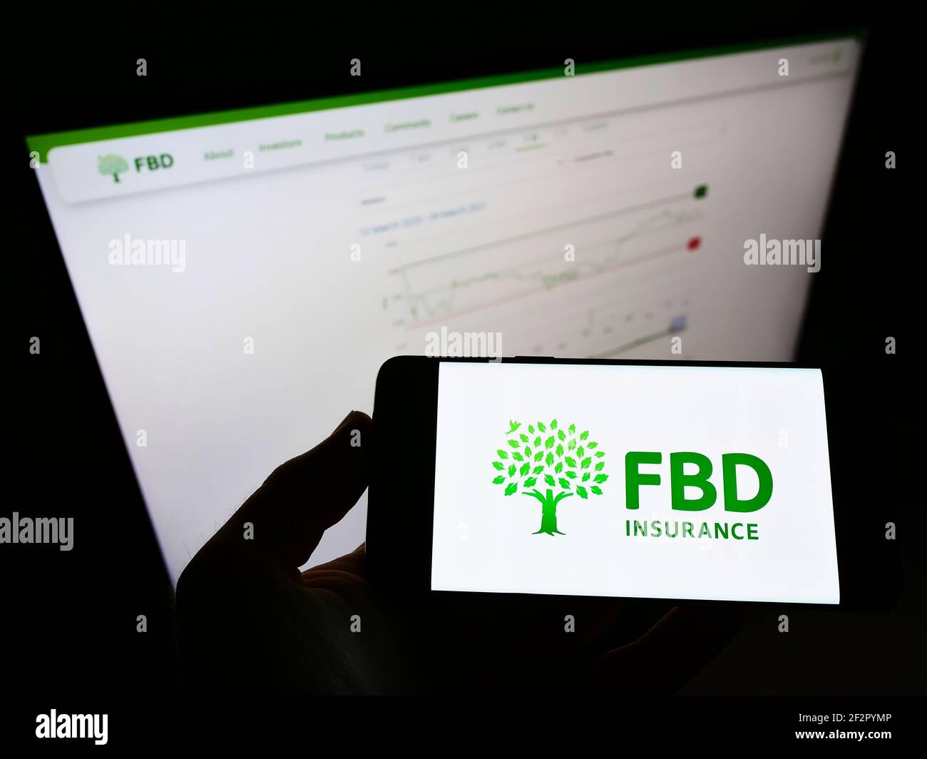 Person holding cellphone with business logo of Irish insurance company ...