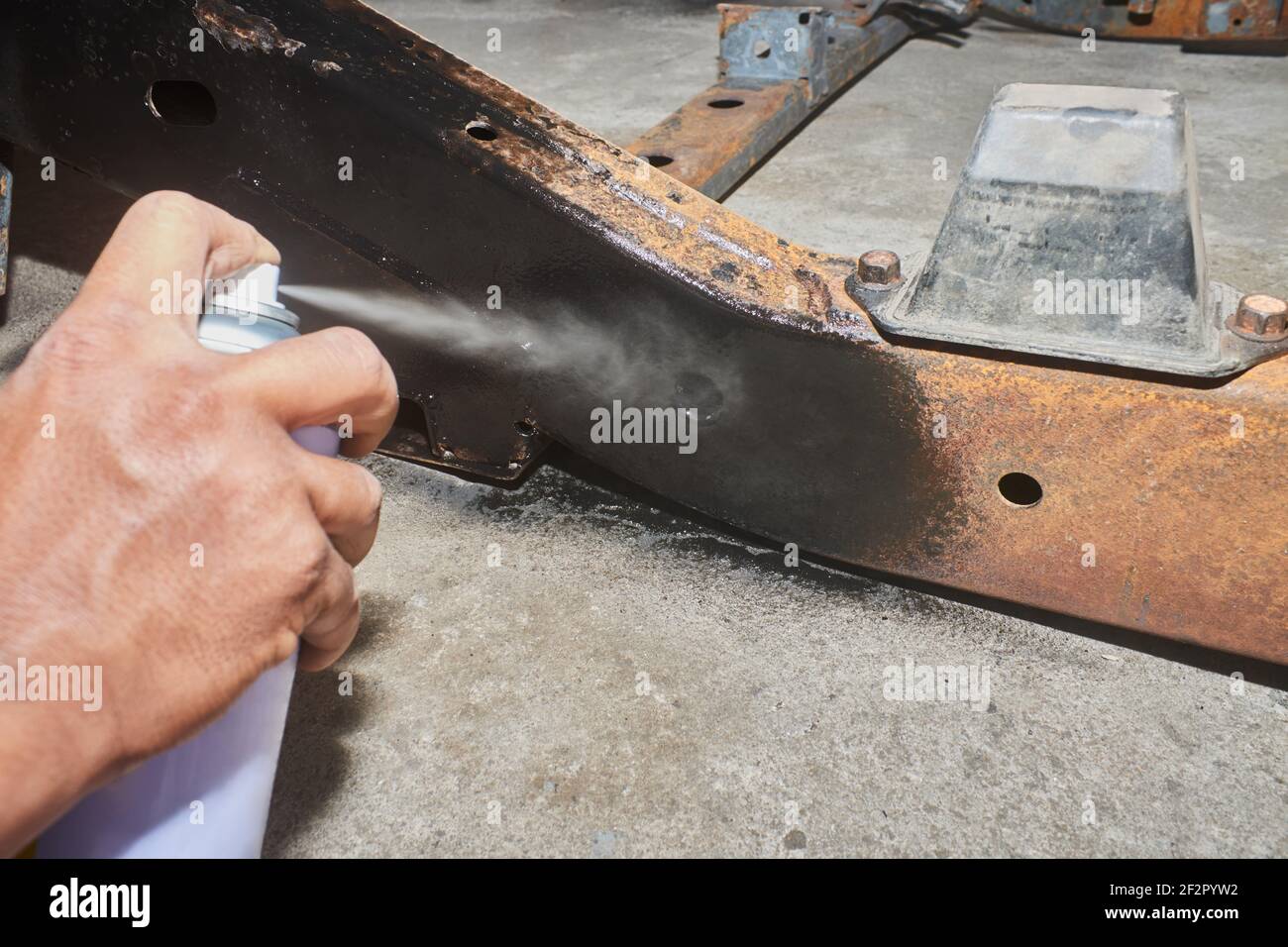 Zoom View Hand of Car Mechanic or Auto Mechanic Spray Paint Side of Car ...