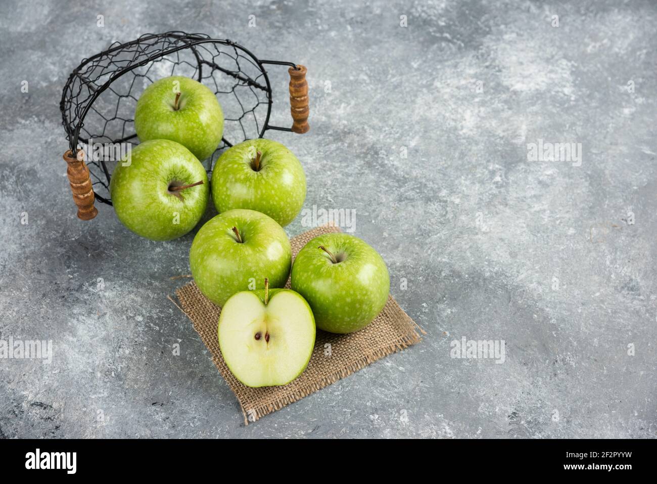 Metal bucket of fresh green apples on marble background Stock Photo - Alamy