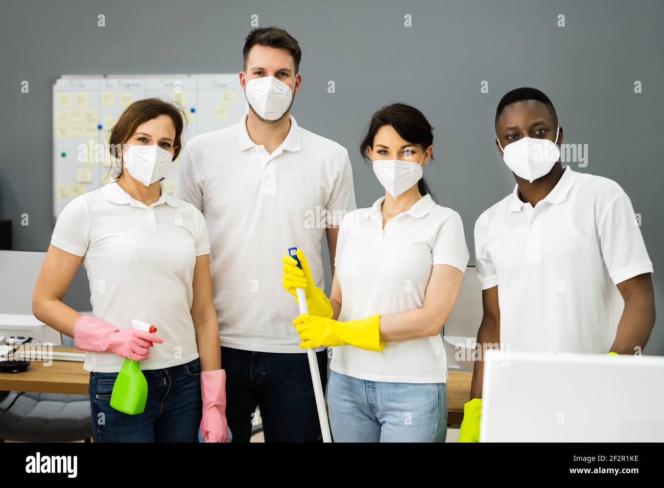 Cleaning Janitor Team Cleaner Group In Face Mask Stock Photo - Alamy
