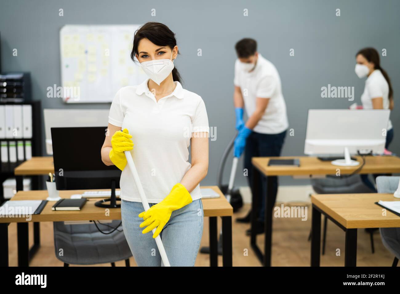 Cleaning Janitor Team Cleaner Group In Face Mask Stock Photo - Alamy
