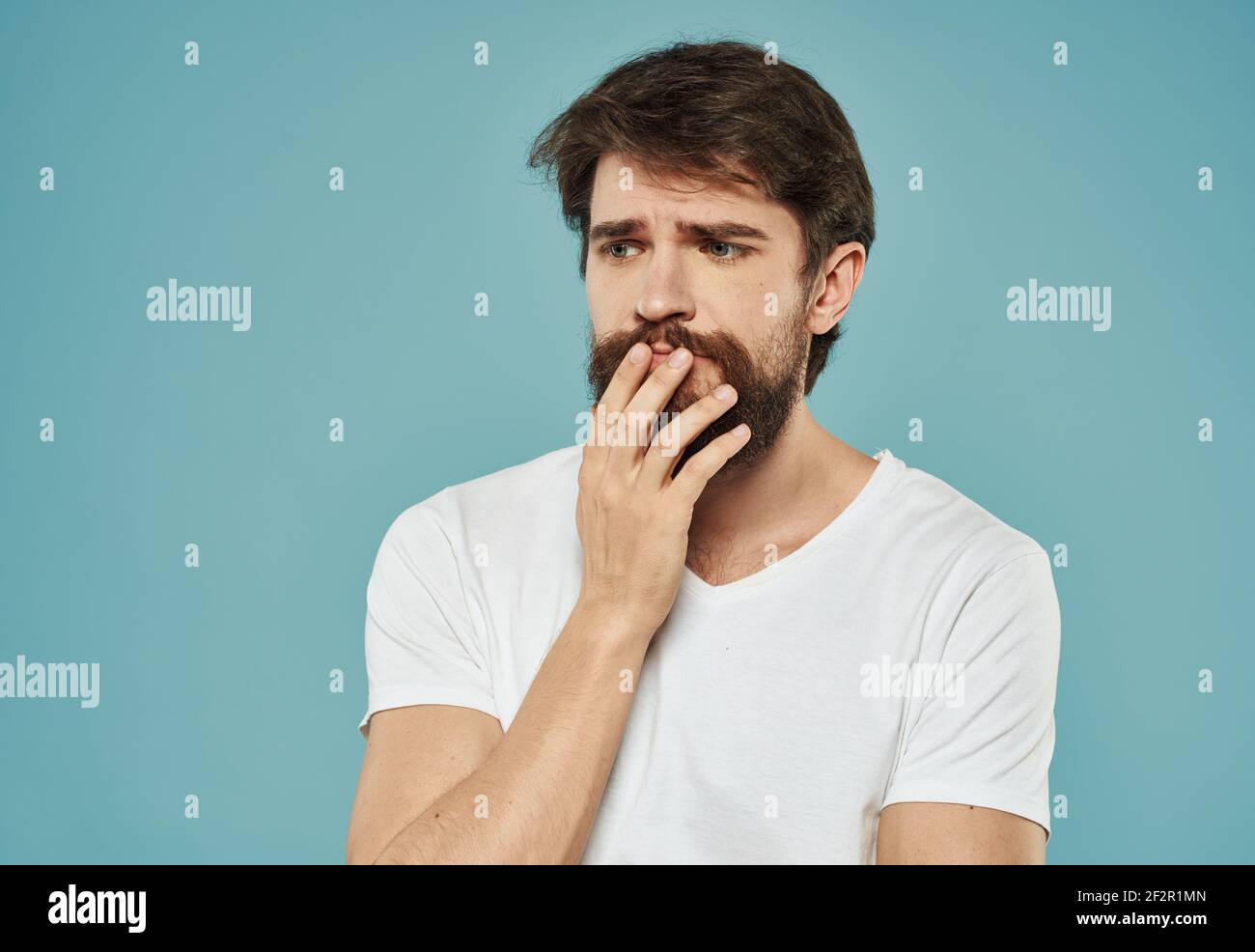Man indignant look portrait emotions blue background model Stock Photo ...