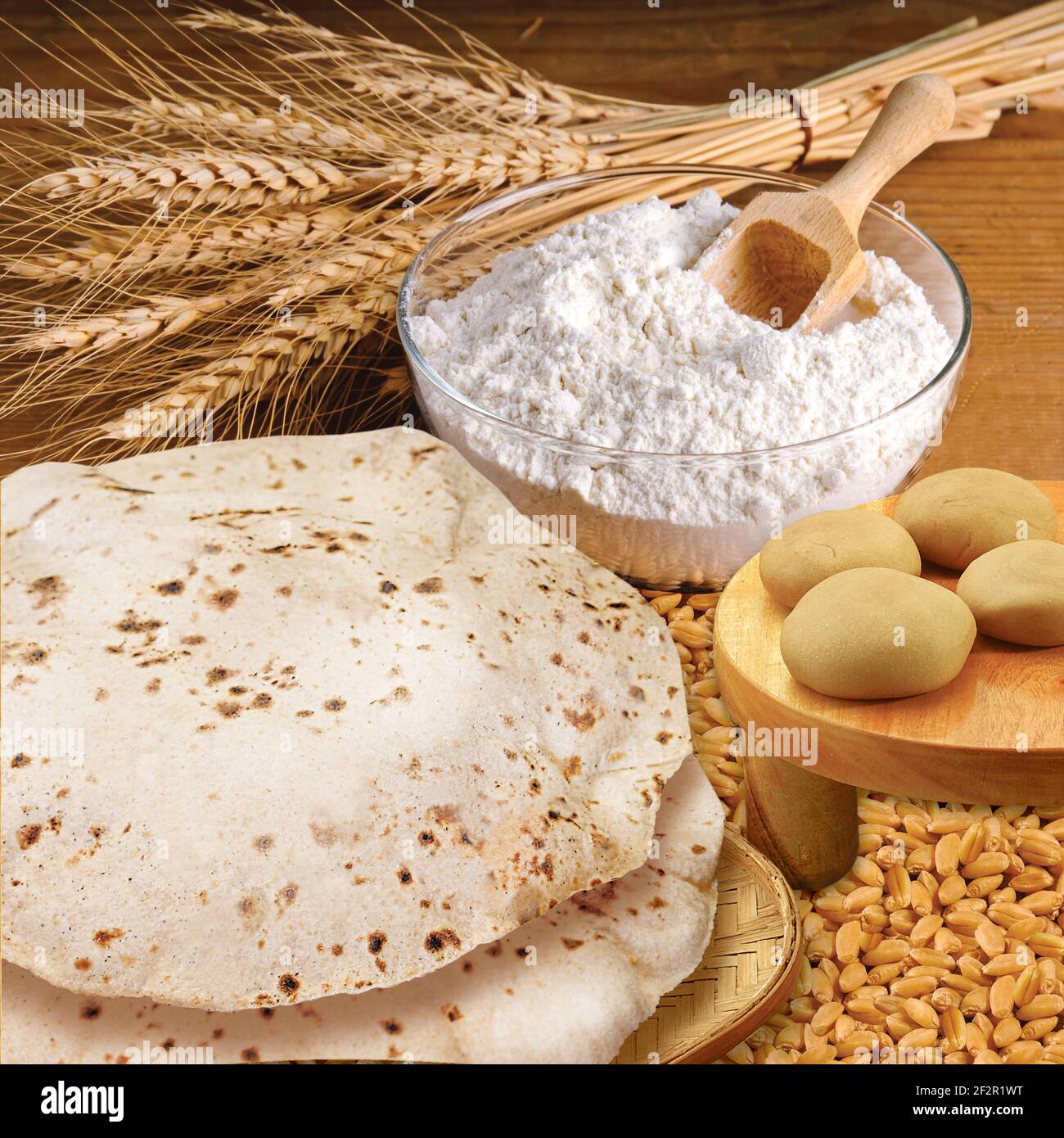 Rustic shot of a plate of chapati surrounded by ingredients Stock Photo ...