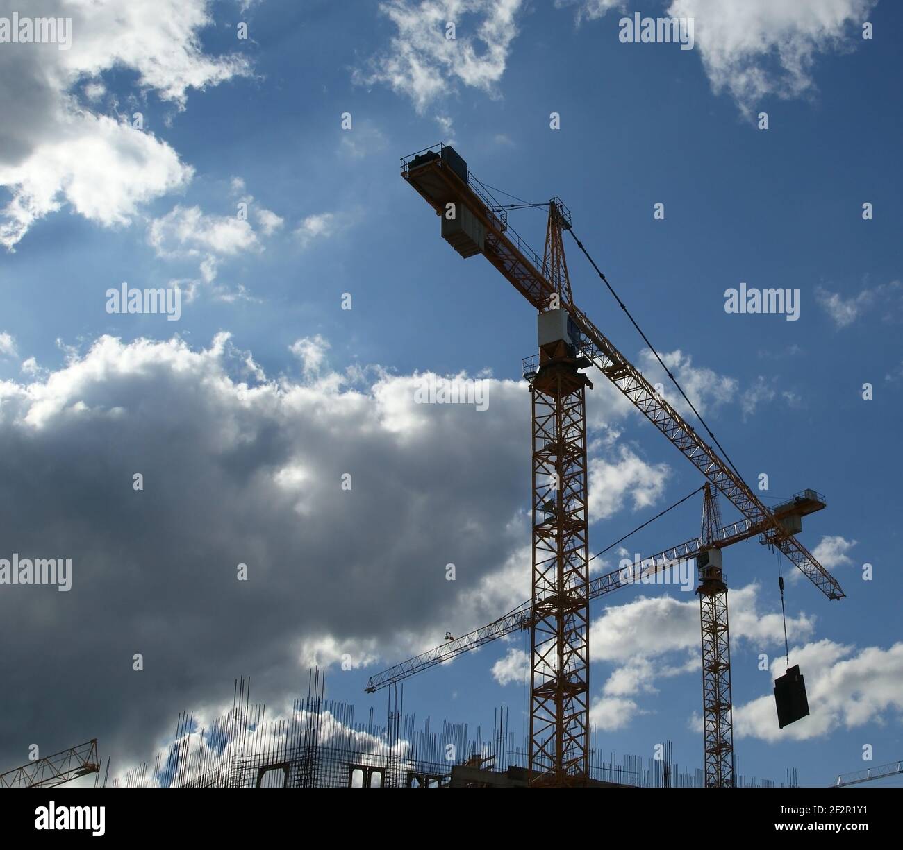 Elevating construction crane Stock Photo - Alamy