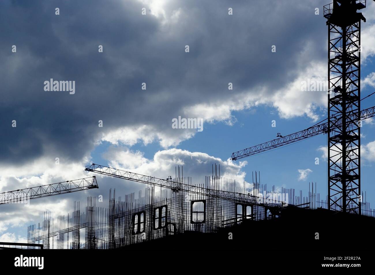 Elevating construction crane Stock Photo - Alamy